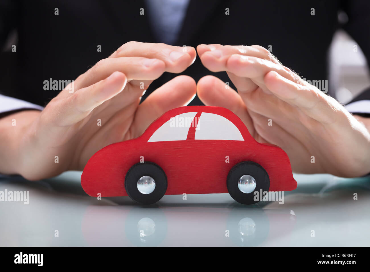 Person's Hand Protecting Red Car Stock Photo - Alamy