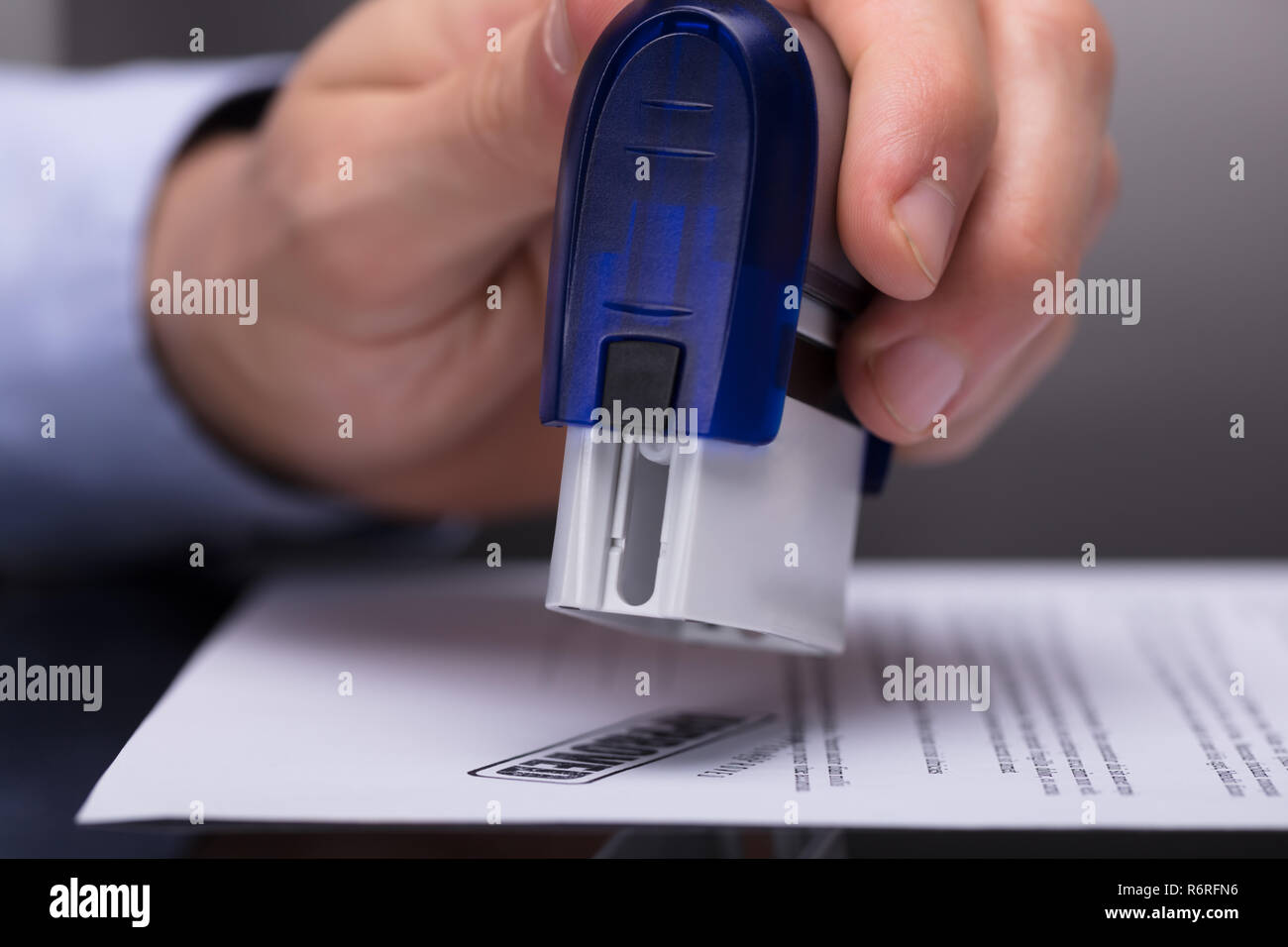 Businessperson Stamping Document Stock Photo - Alamy