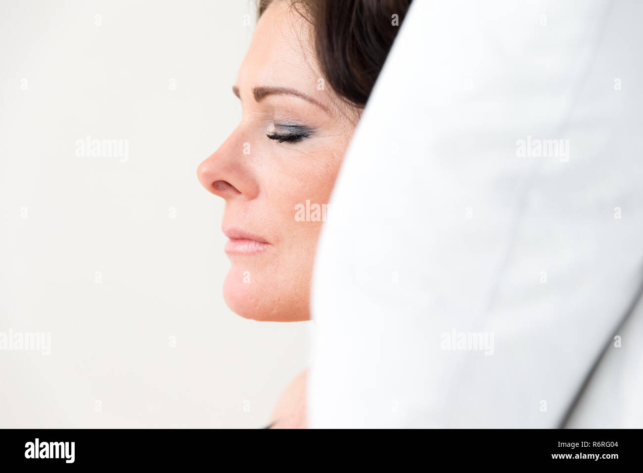 Woman in bed Stock Photo - Alamy