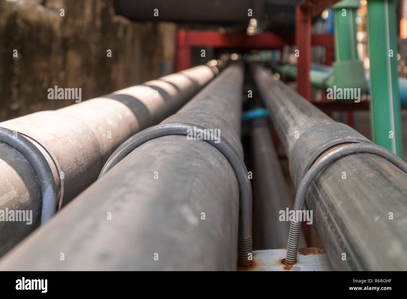 Black and black long steel pipe next to the black concrete wall Stock ...