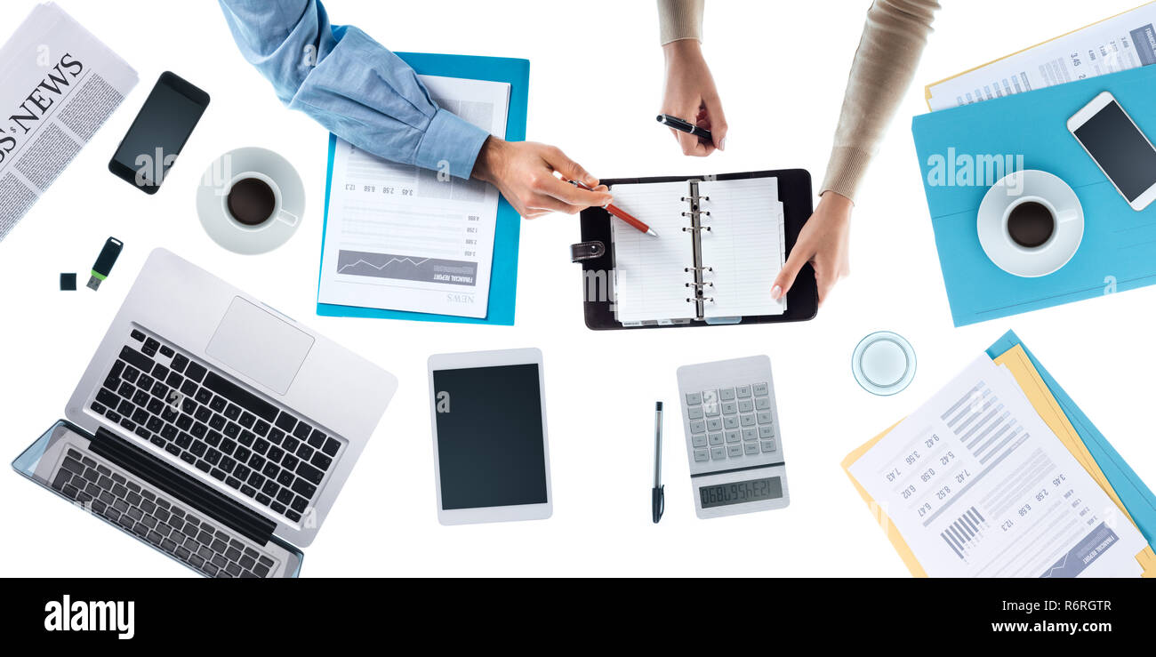 Business team checking appointment schedules Stock Photo - Alamy