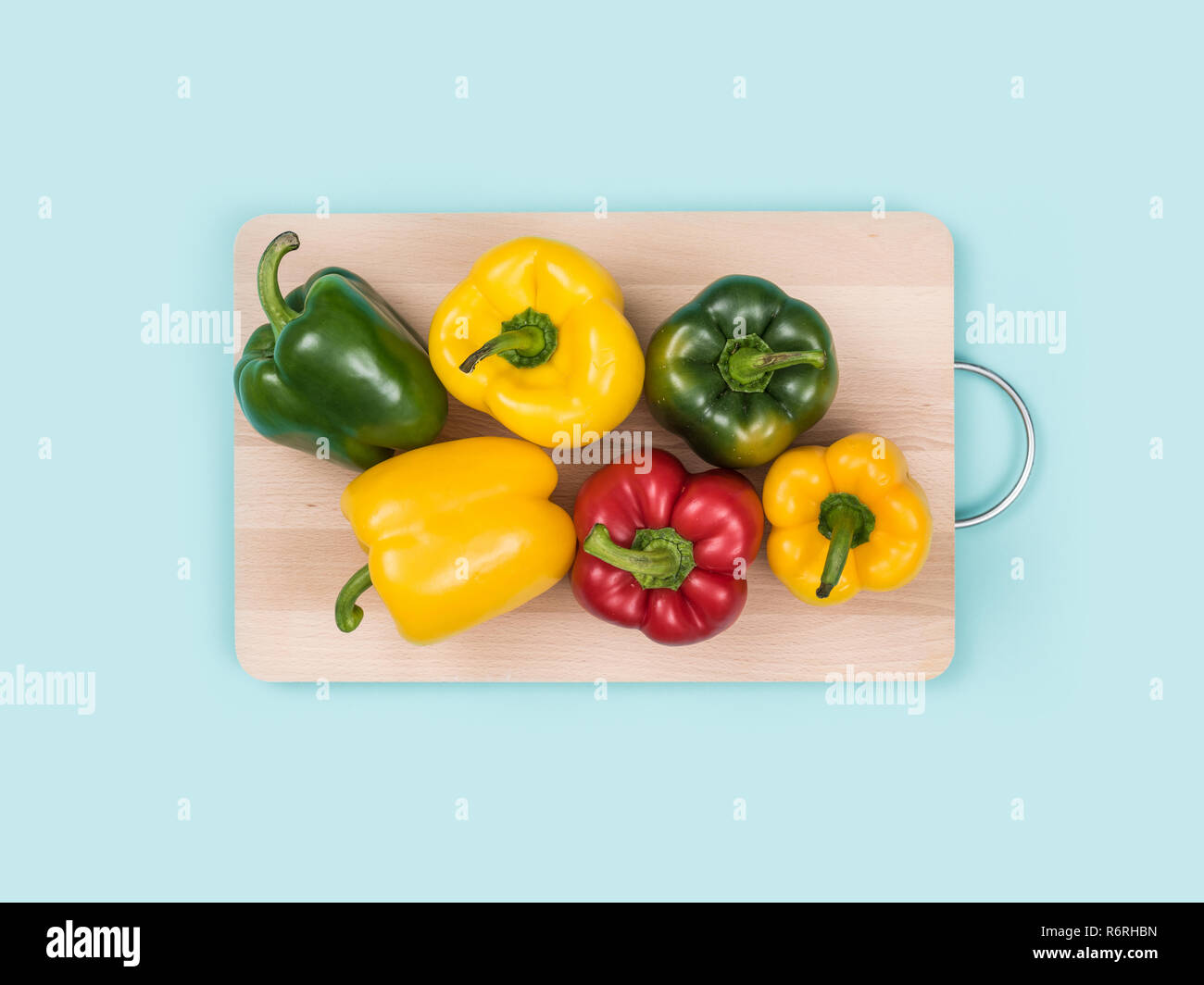 Fresh bell peppers on a chopping board Stock Photo - Alamy