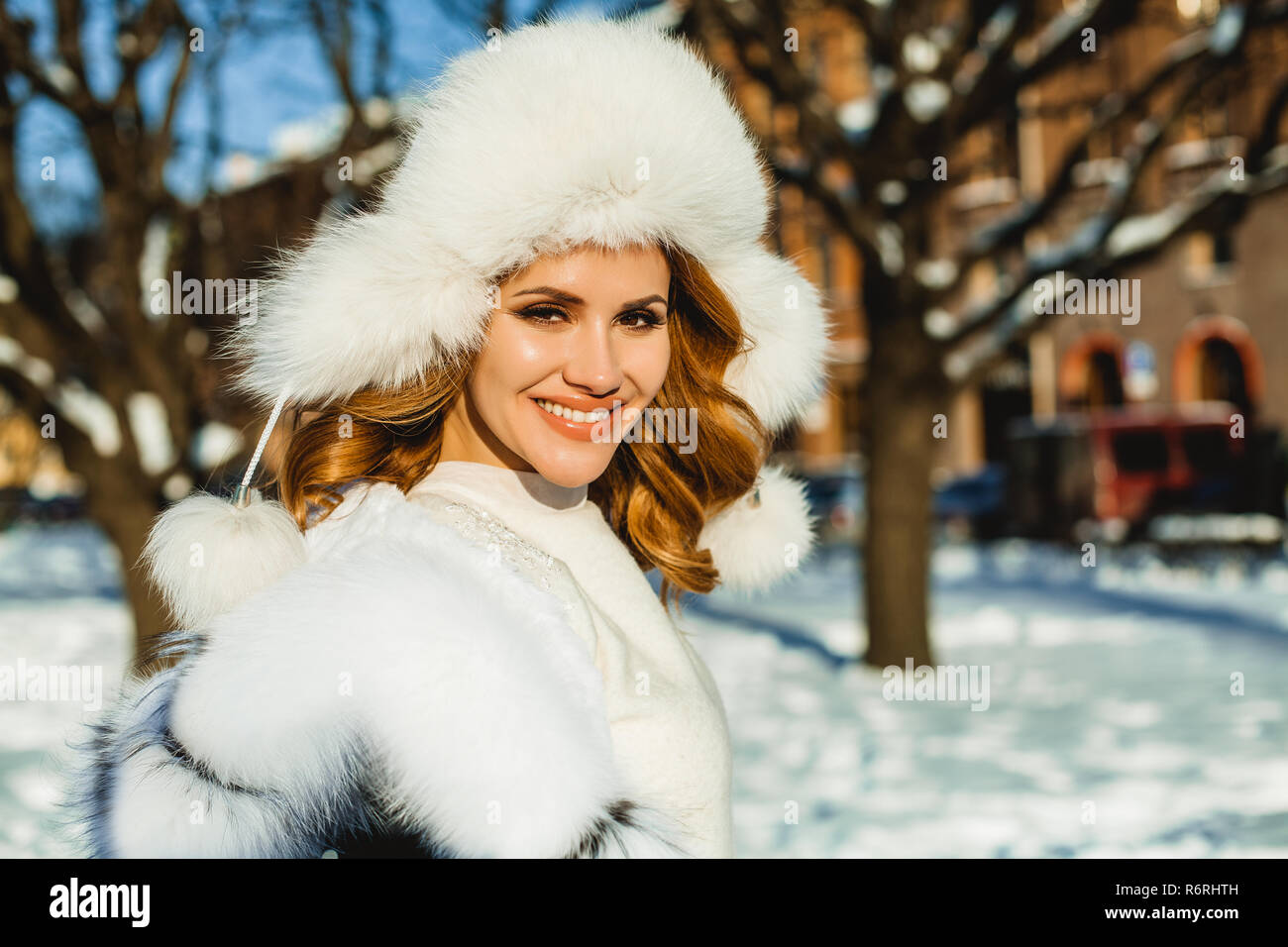 Happy winter girl outdoors. Friendly woman face Stock Photo - Alamy