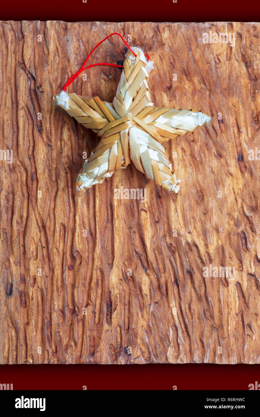 Beautiful star made of vegetable fibers on wooden craftsman background ...