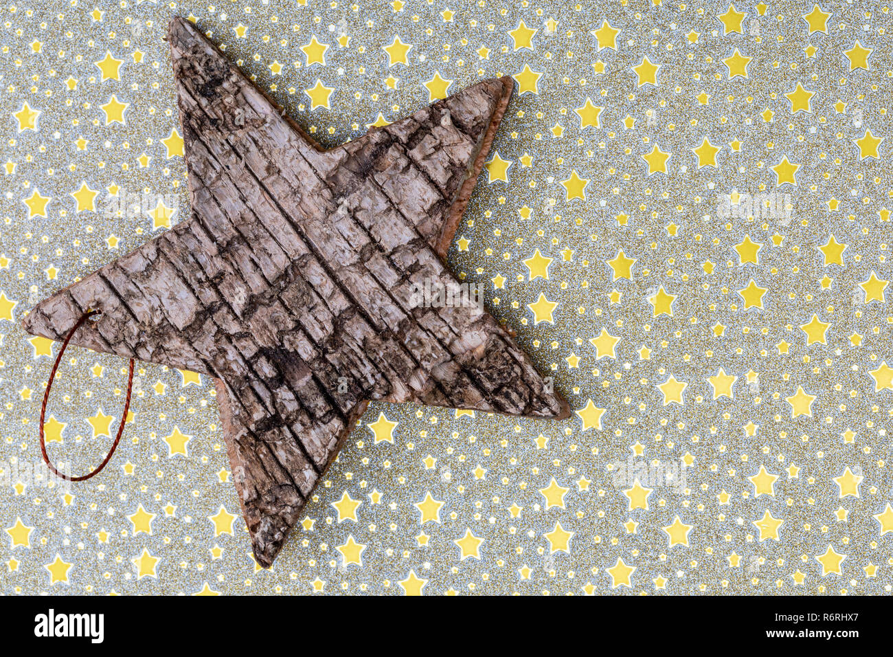 Beautiful star of birch bark on golden stars background. Ready for ...