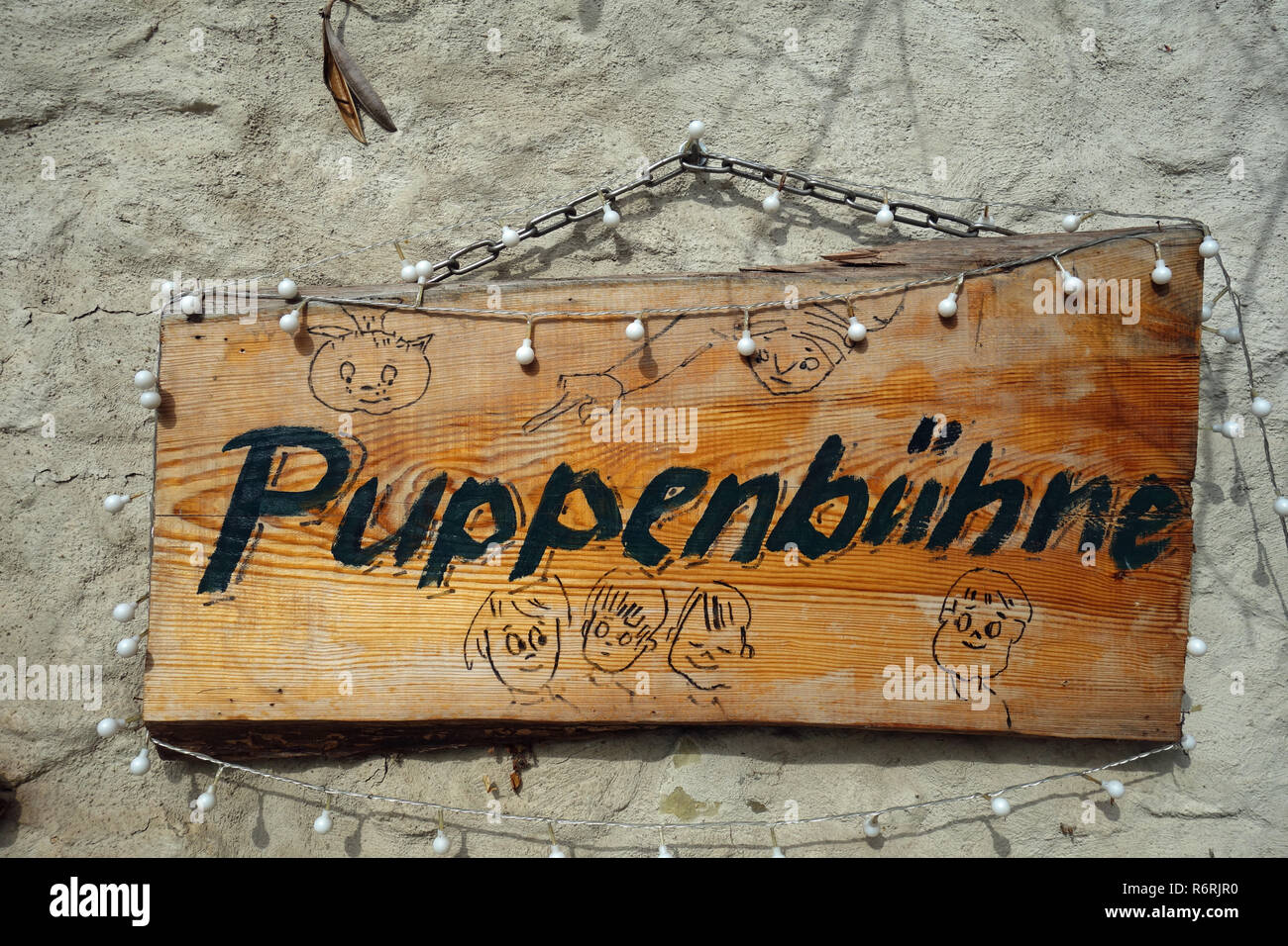 wooden sign doll stage Stock Photo - Alamy