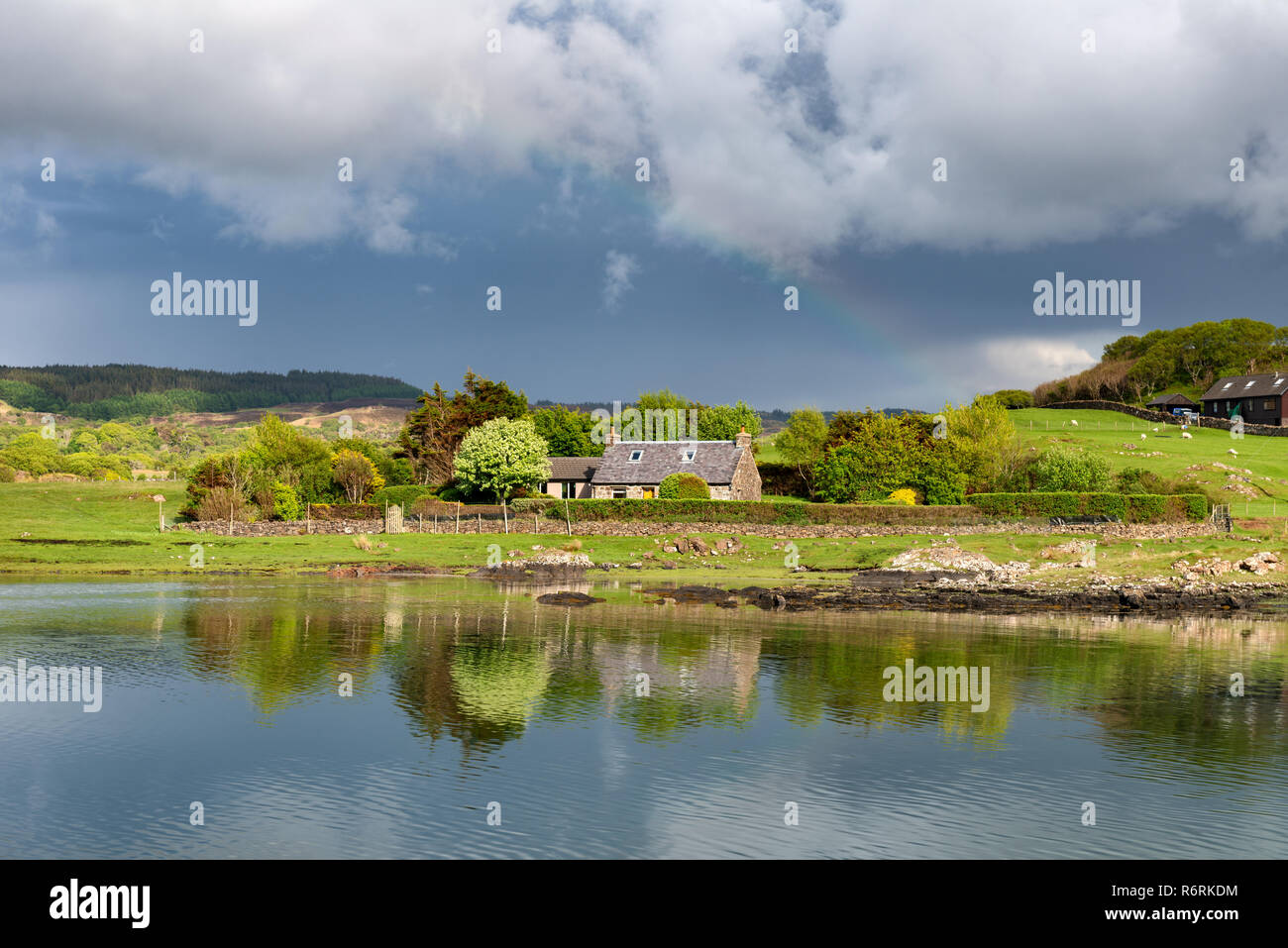 A cottage with a view of Croig harbour on the Isle of Mull Stock Photo ...