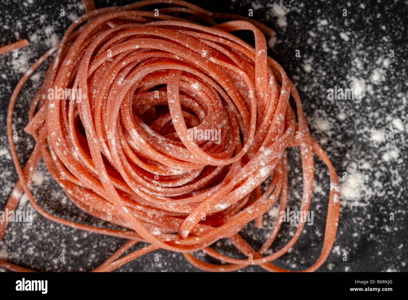 Pasta on black top view, food above Stock Photo - Alamy