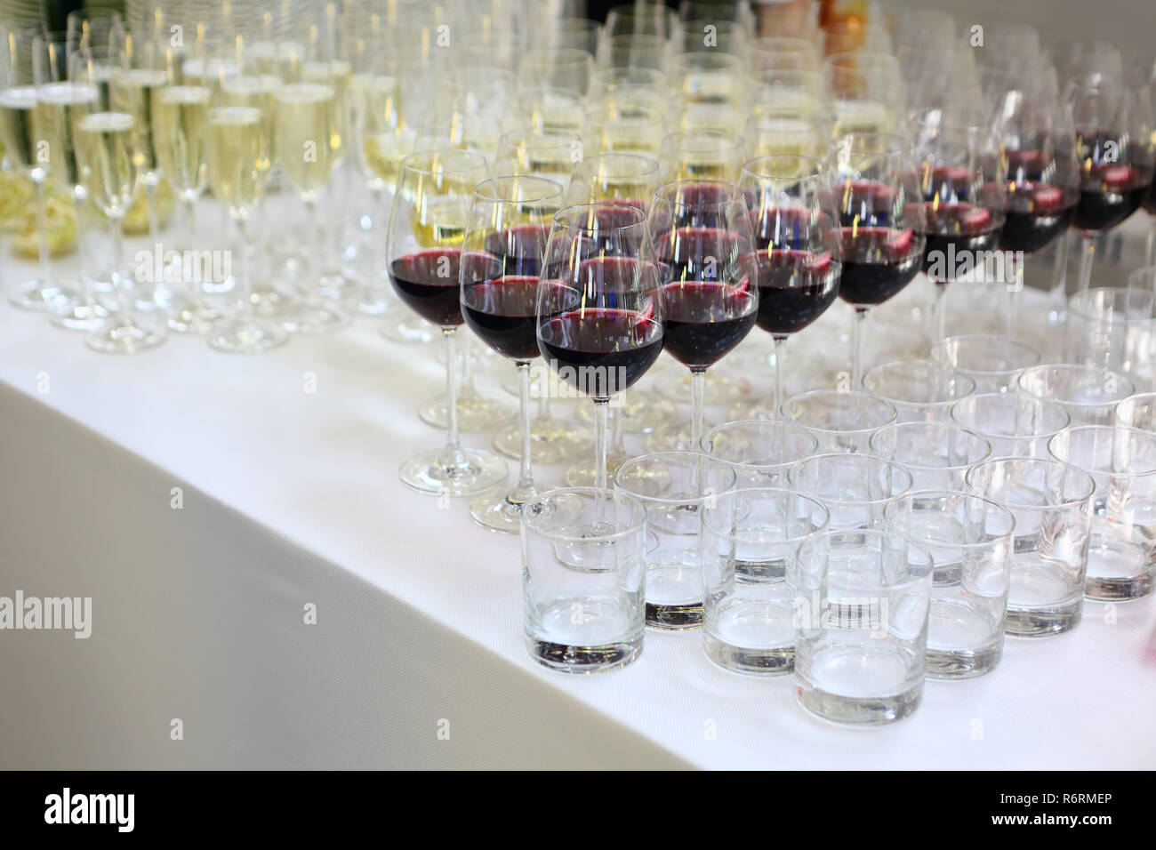 Alcohol buffet on white table Stock Photo - Alamy