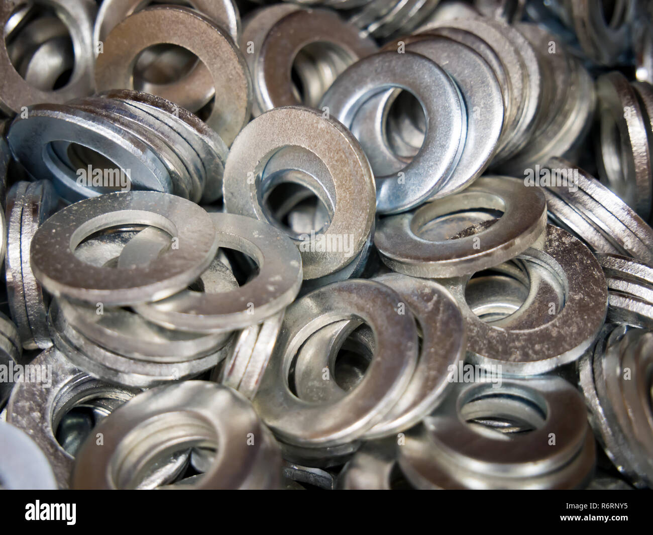 Metal washers in the form of a background Stock Photo - Alamy