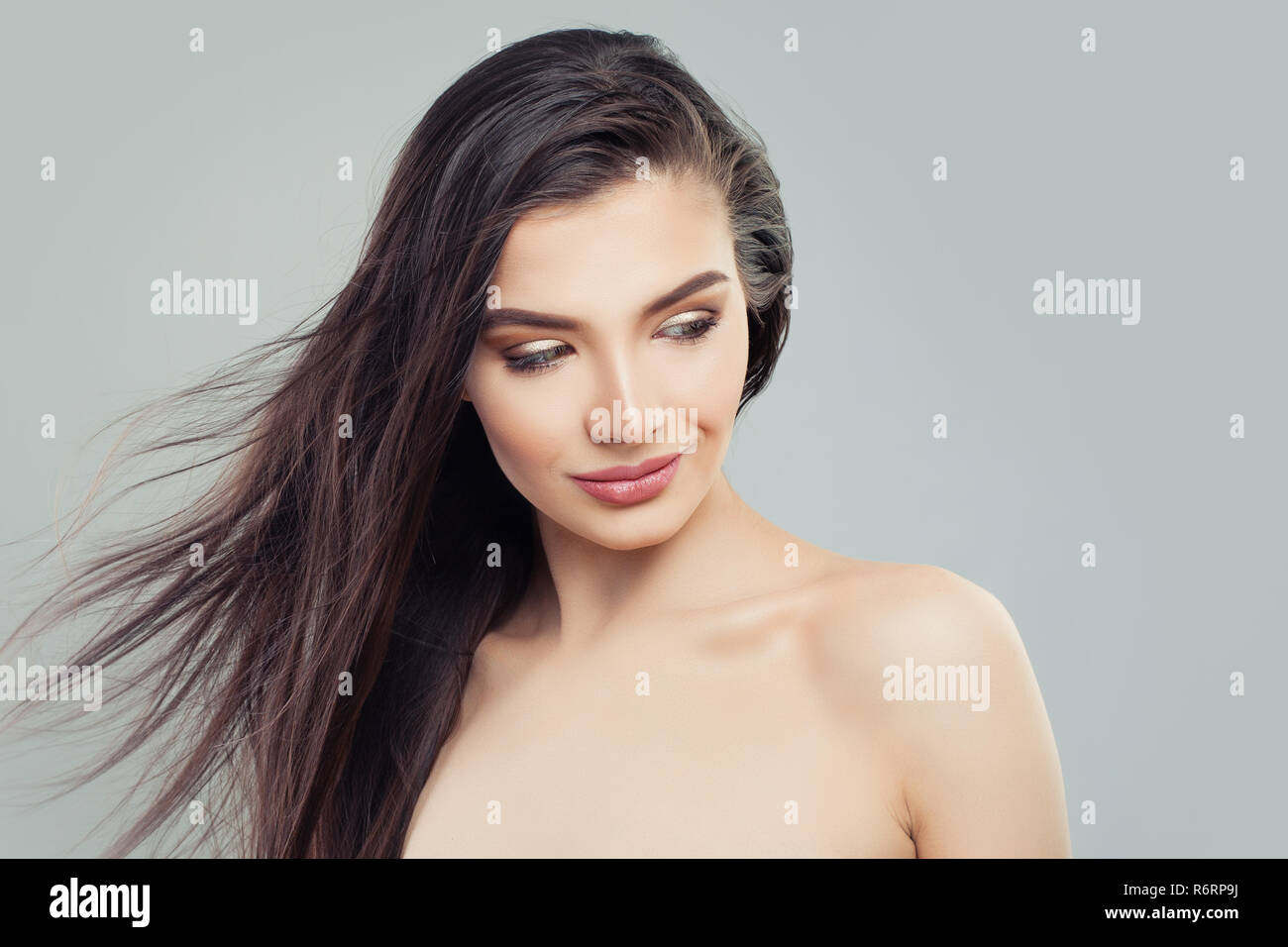 Beautiful woman with healthy skin and long perfect hair on white ...