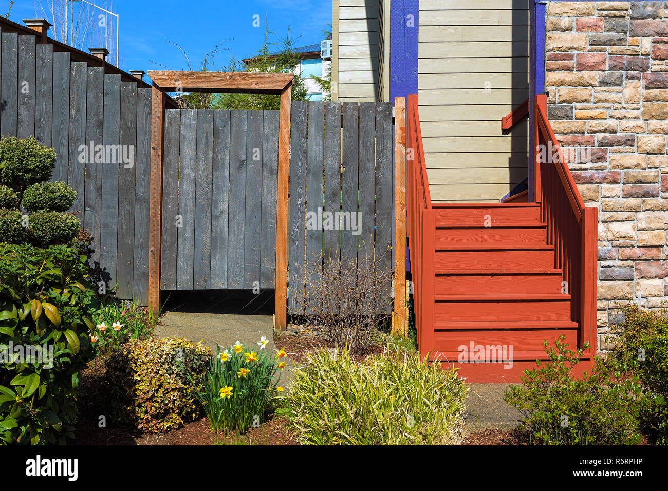 House Frontyard with Wood Stairs and Fence Stock Photo - Alamy