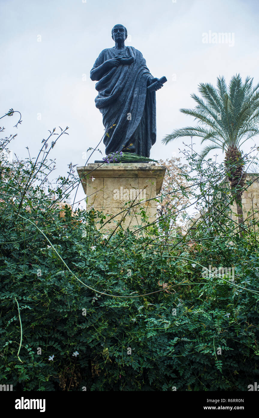 Bronze Statue of Seneca the Younger between jasmine garden Stock Photo ...