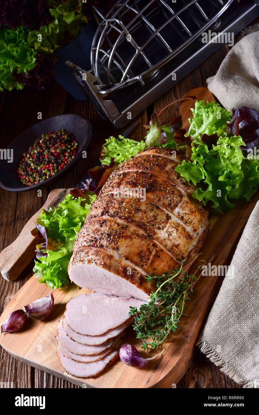 cooked ham with colorful pfefer Stock Photo - Alamy