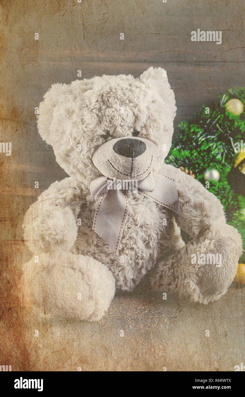 gray teddy bear in Christmas composition with gift box, toy and a ...