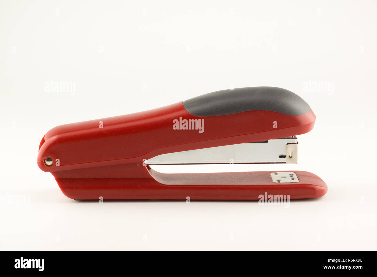 new stapler for stapling papers on a table Stock Photo - Alamy