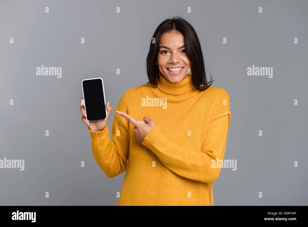 Image of amazing excited woman posing isolated over grey wall ...