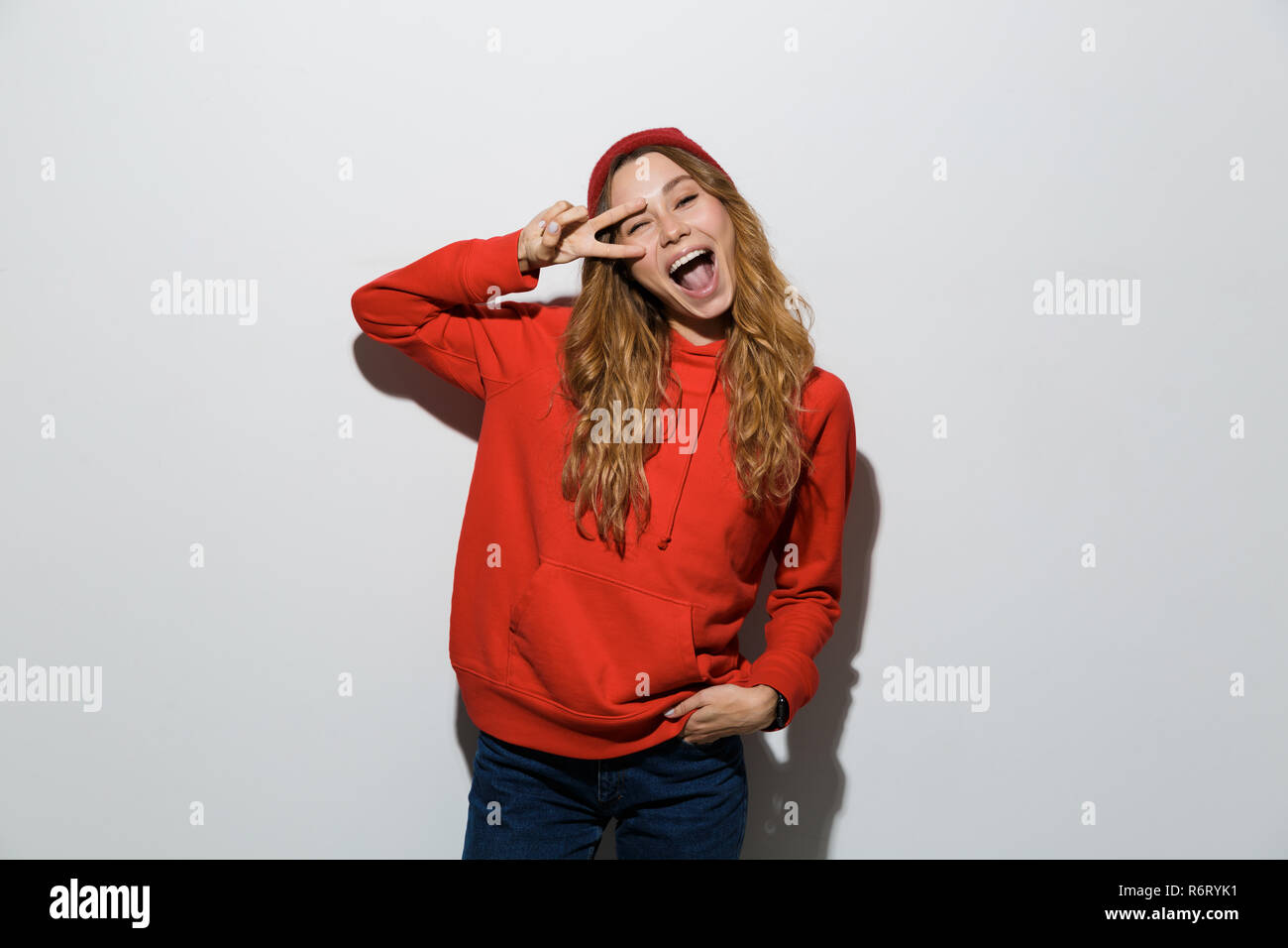 Image of caucasian woman in basic clothing laughing and gesturing at ...
