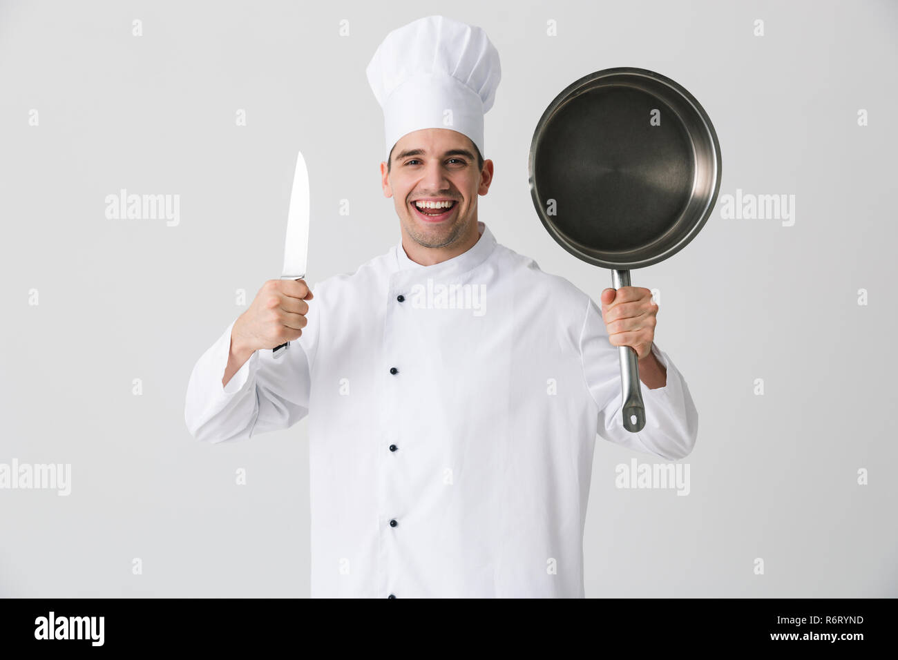 Image of excited emotional young man chef indoors isolated over white ...