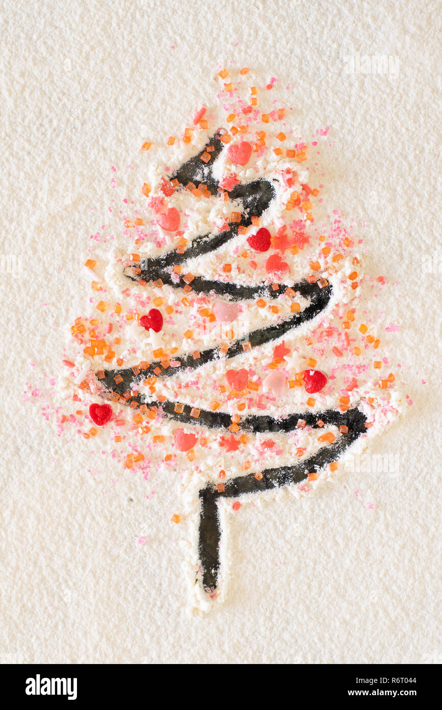 A Christmas tree with sweet sprinkles on top Stock Photo - Alamy