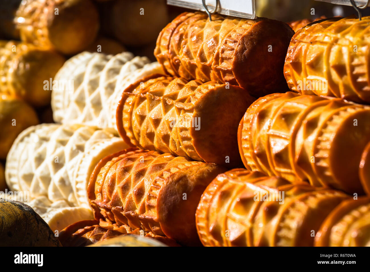 traditional polish smoked cheese oscypek on outdoor market in zakopane ...