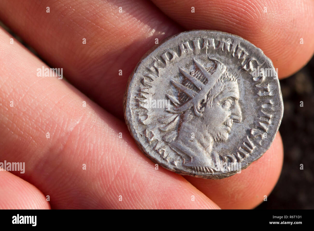 Hand holding roman denarius hi-res stock photography and images - Alamy