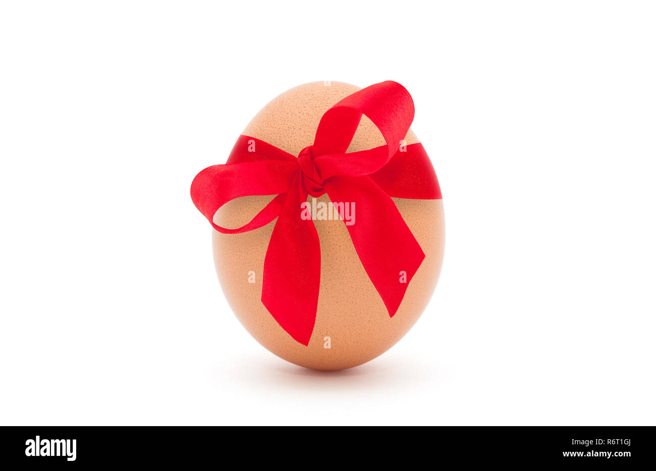 Easter egg with red ribbon isolated on white background Stock Photo - Alamy
