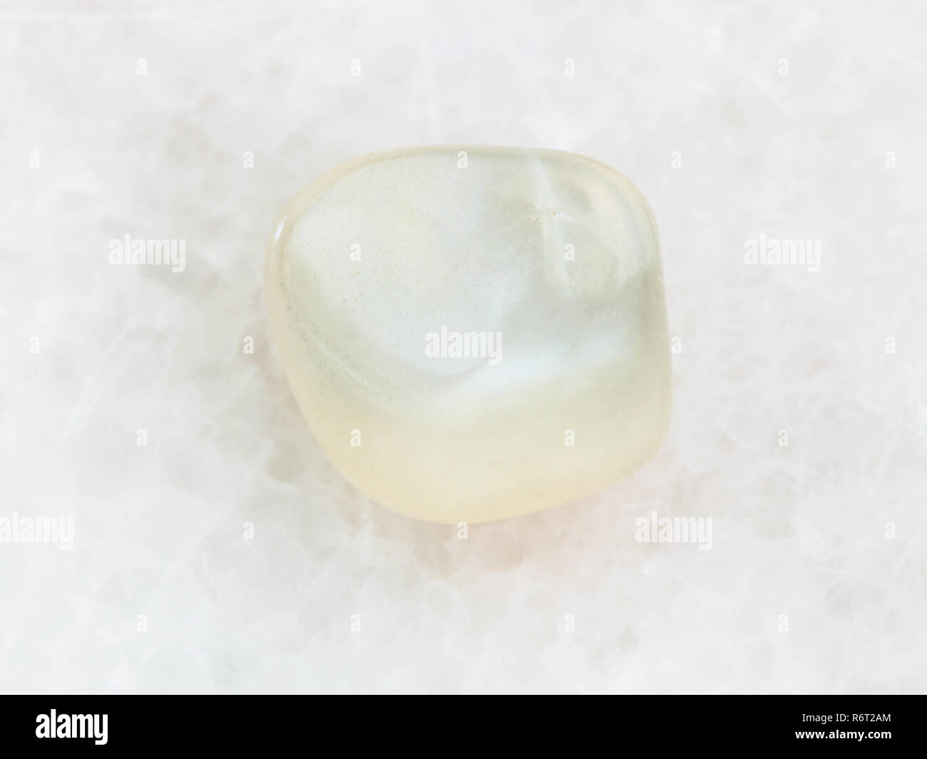 polished translucent moonstone gemstone on white Stock Photo - Alamy