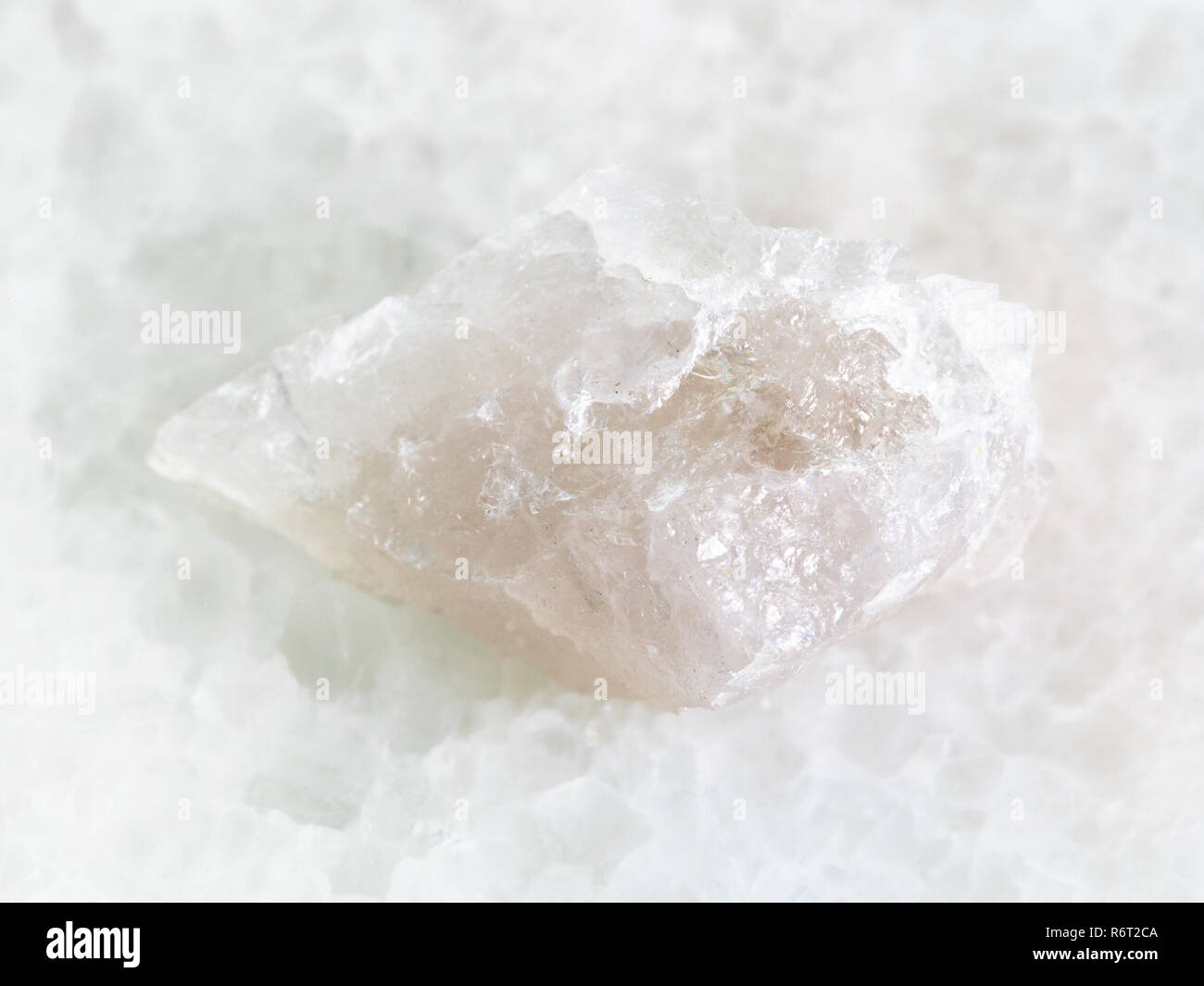 rough Quartz stone on white marble Stock Photo - Alamy