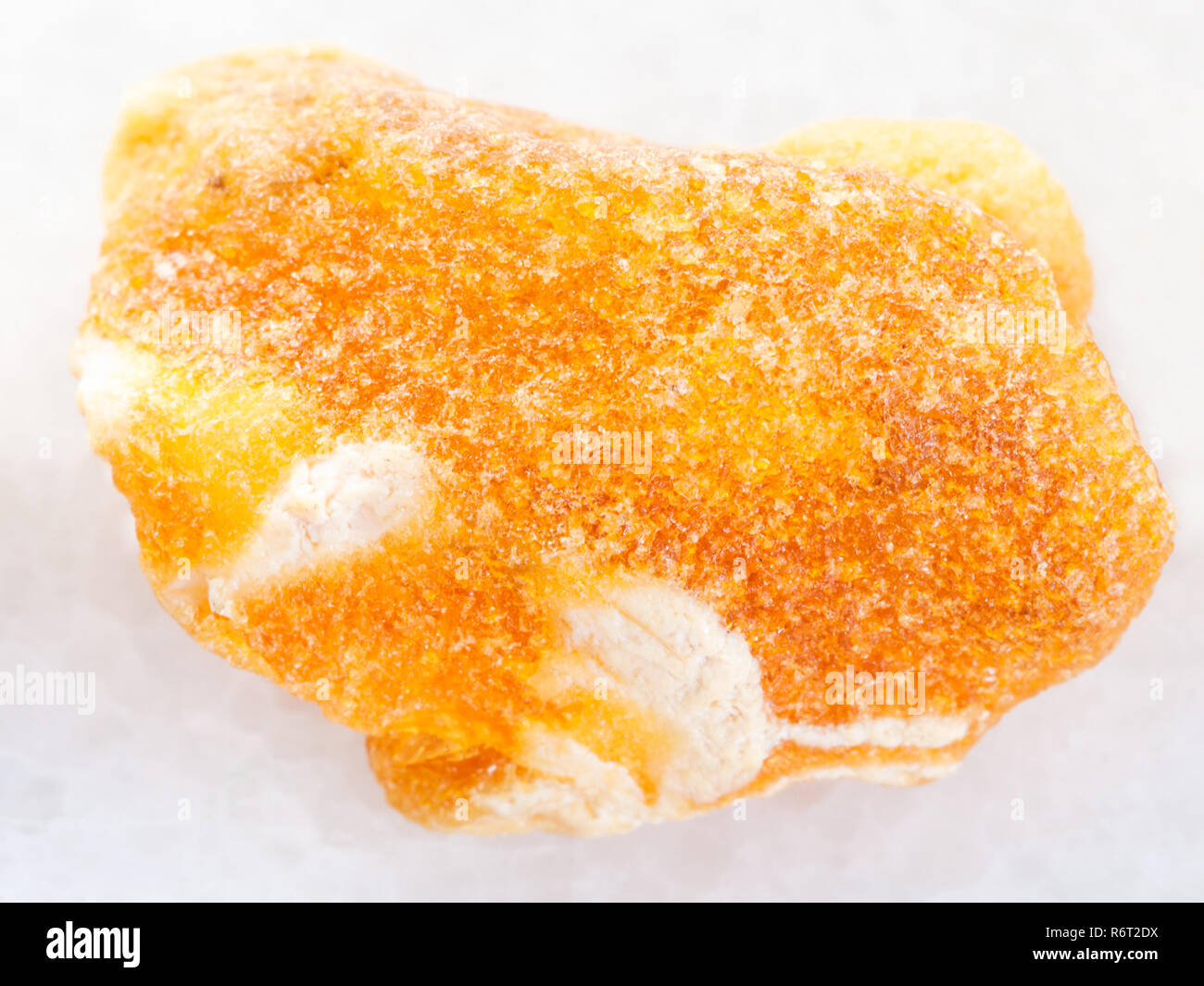 raw baltic Amber stone on white marble Stock Photo - Alamy