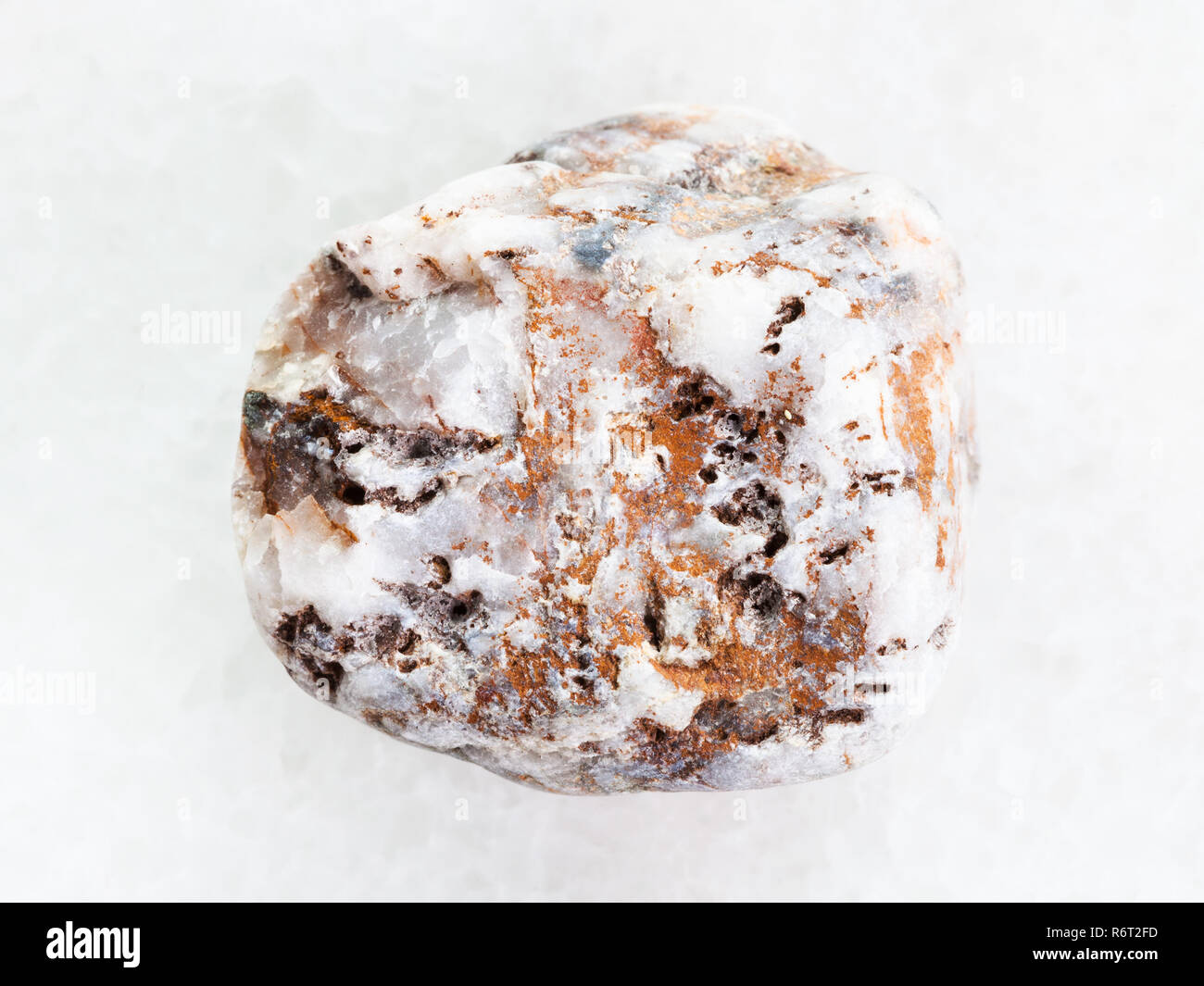 marble pebble on white marble background Stock Photo - Alamy