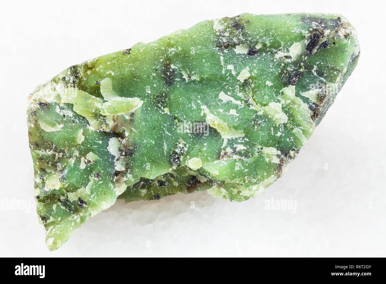 rough Lizardite stone on white Stock Photo - Alamy