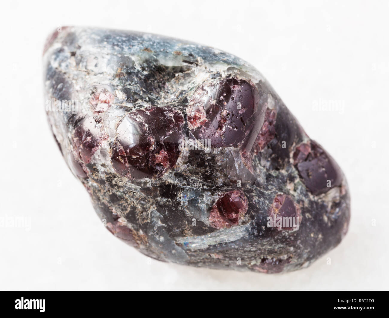 polished Almandine garnet crystals on white marble Stock Photo - Alamy