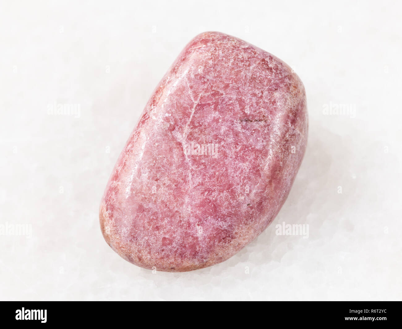 tumbled rhodonite gem on white Stock Photo - Alamy