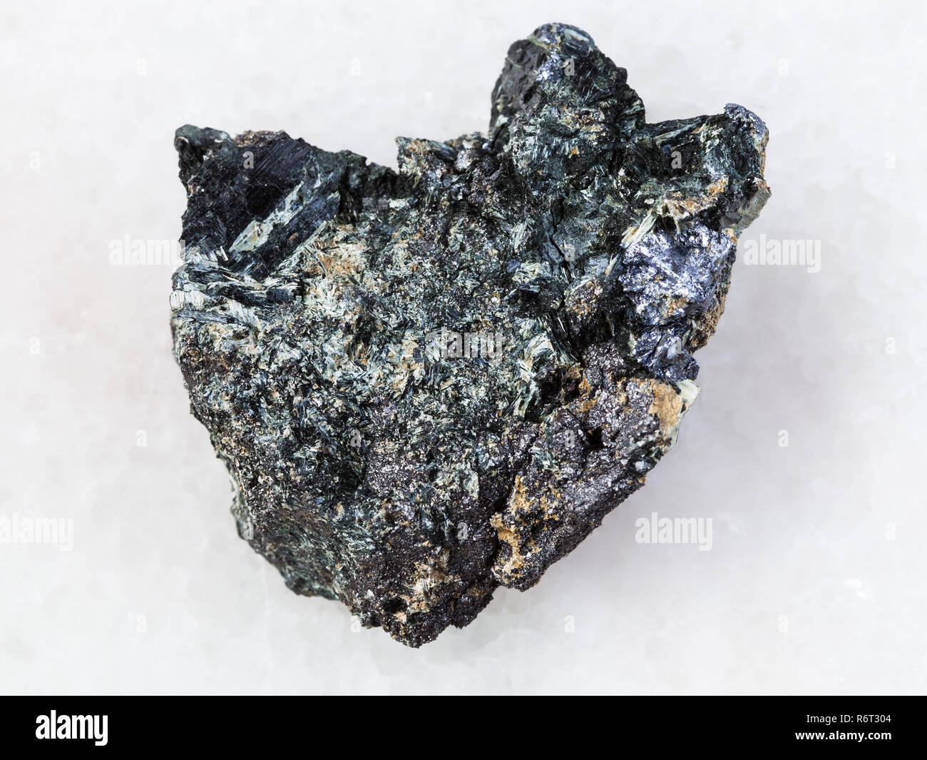 Molybdenite crystal in rough Glaucophane on white Stock Photo - Alamy