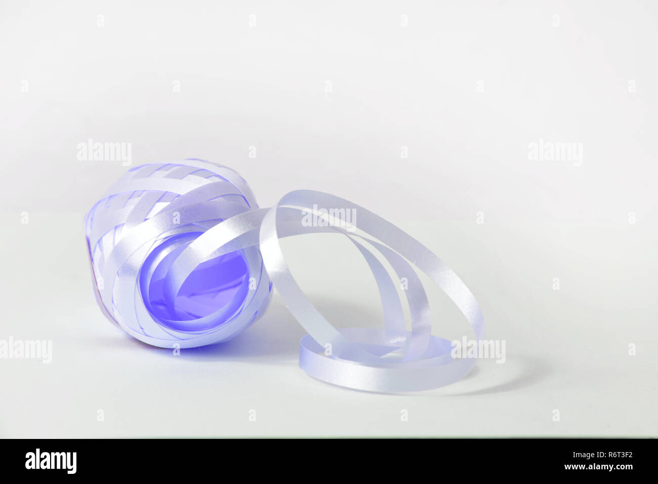 Curling Ribbon - Colorful gift wrapping band on white background Stock ...