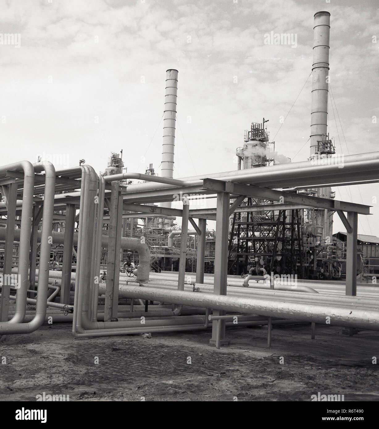 1960s, historical, exterior view of the vast array of the pipelines at ...