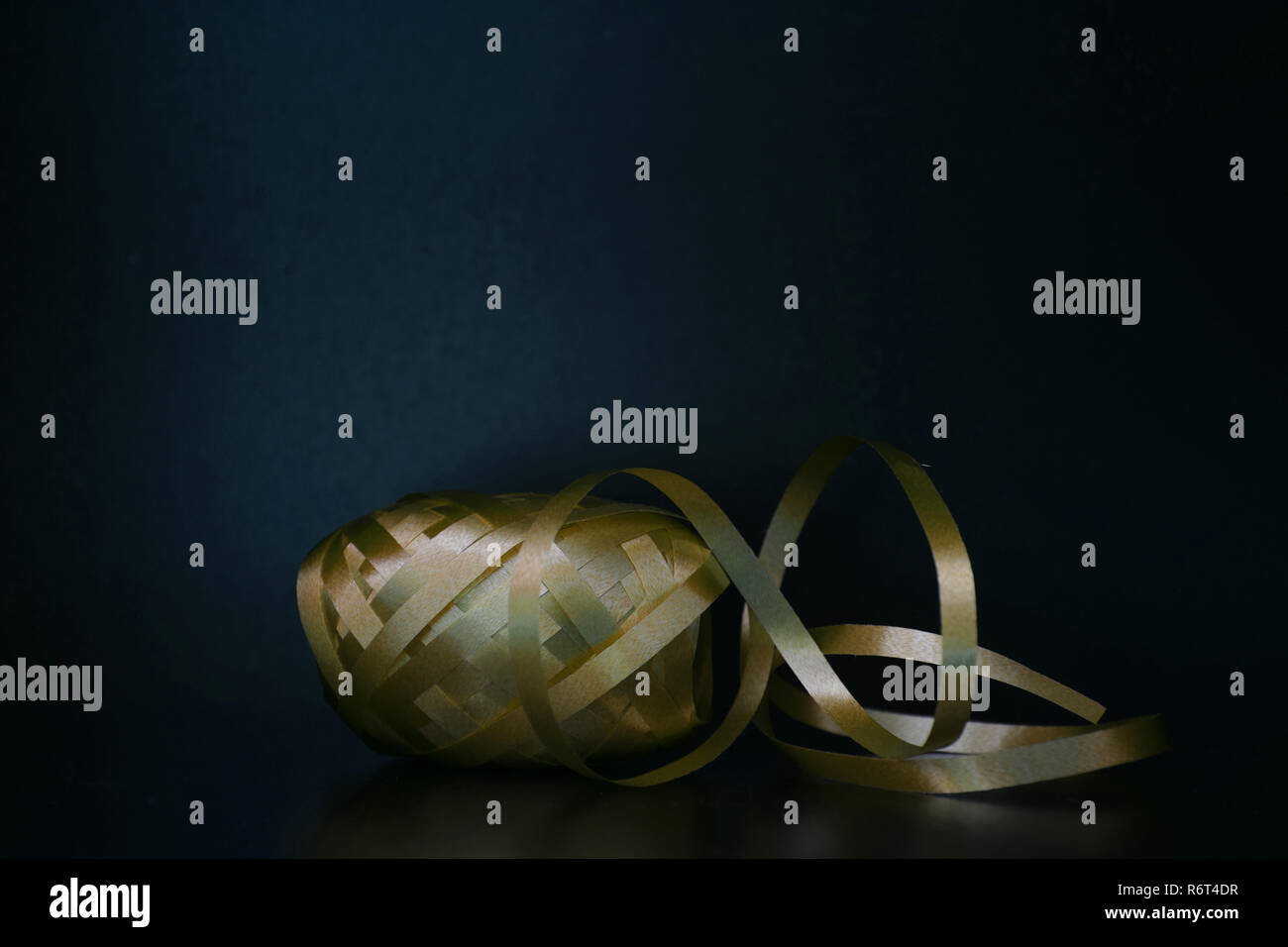 Curling Ribbon - Colorful gift wrapping band on black background Stock ...