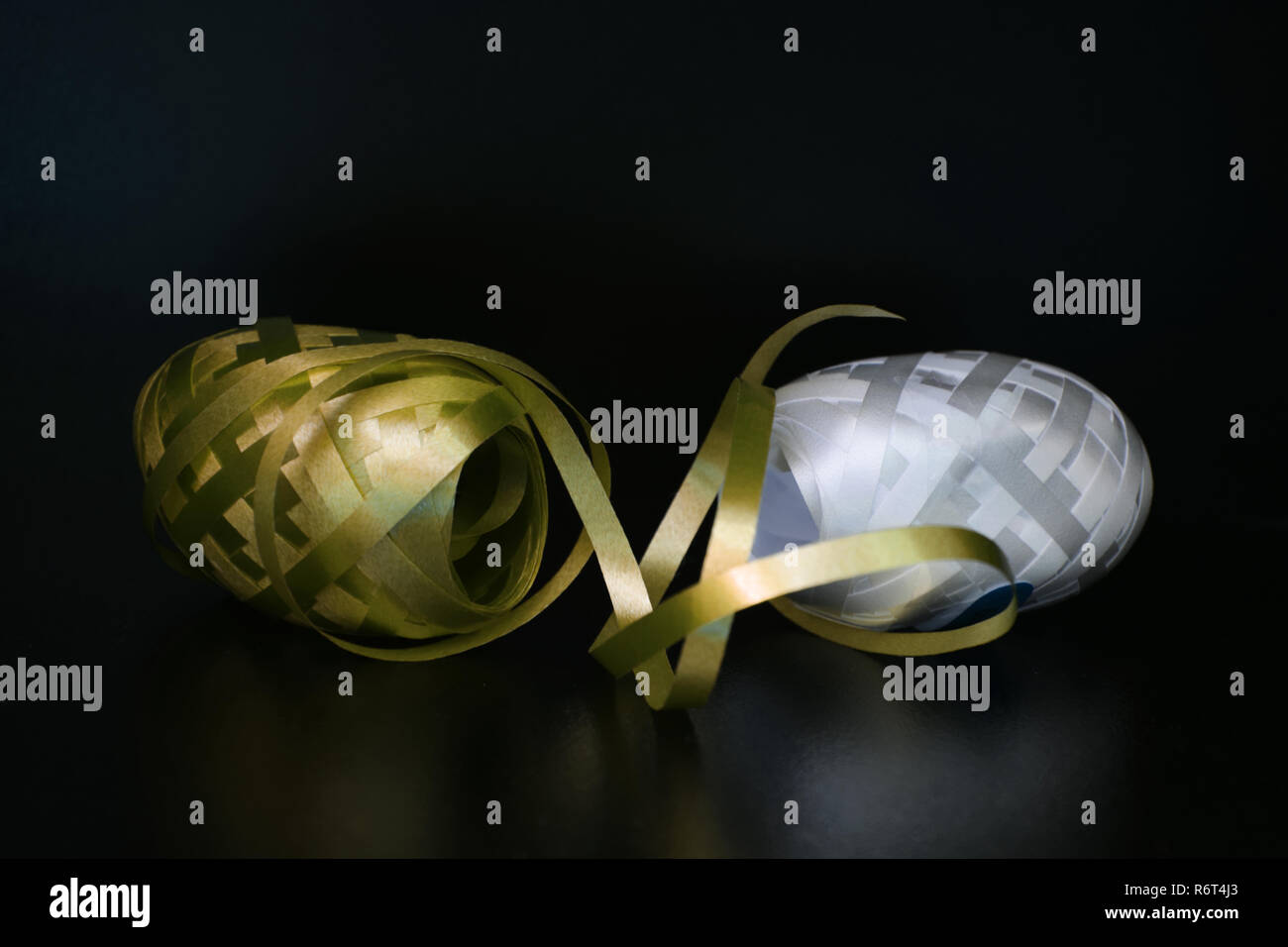 Curling Ribbon - Colorful gift wrapping band on black background Stock ...