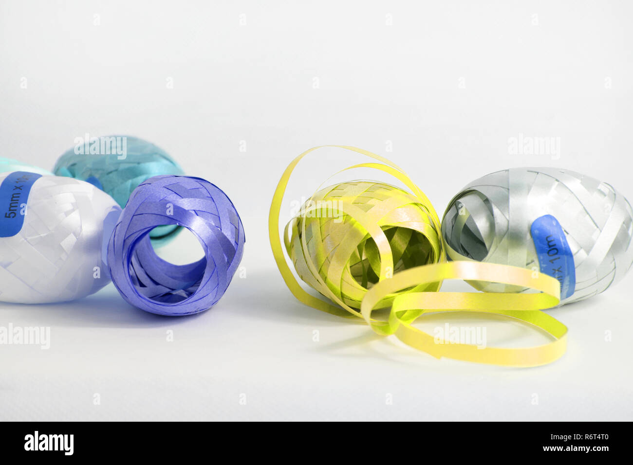 Curling Ribbon - Colorful gift wrapping band on white background Stock ...