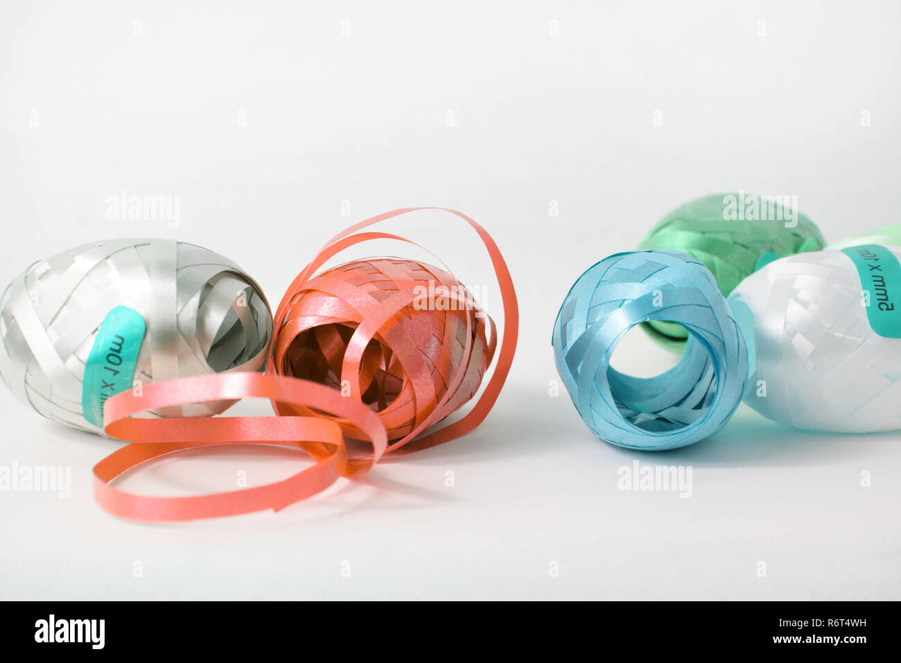 Curling Ribbon - Colorful gift wrapping band on white background Stock ...