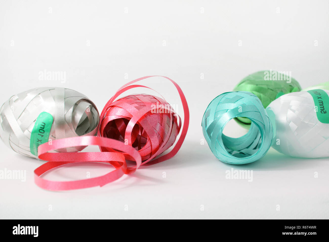 Curling Ribbon - Colorful gift wrapping band on white background Stock ...