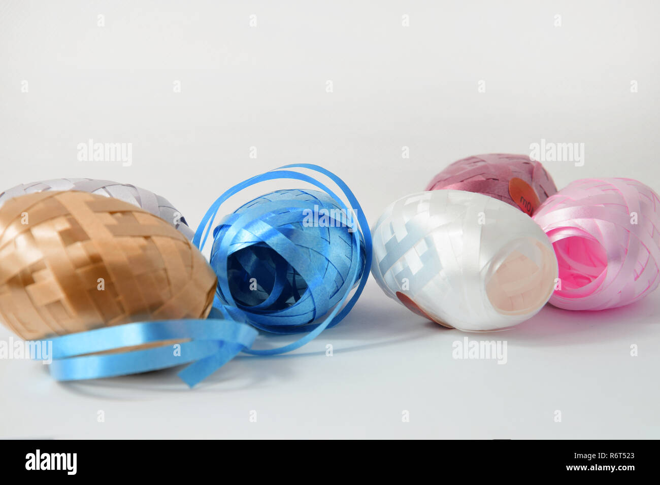 Curling Ribbon - Colorful gift wrapping band on white background Stock ...