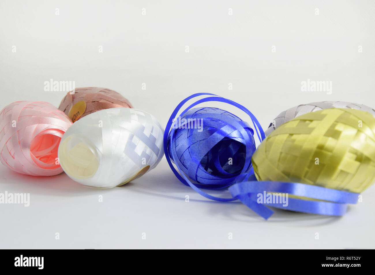 Curling Ribbon - Colorful gift wrapping band on white background Stock ...