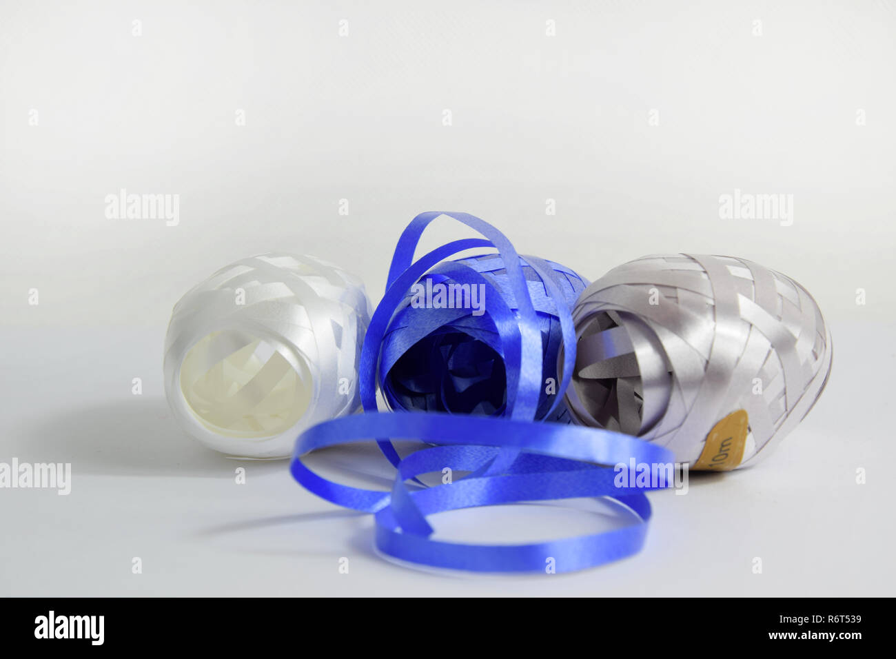 Curling Ribbon - Colorful gift wrapping band on white background Stock ...