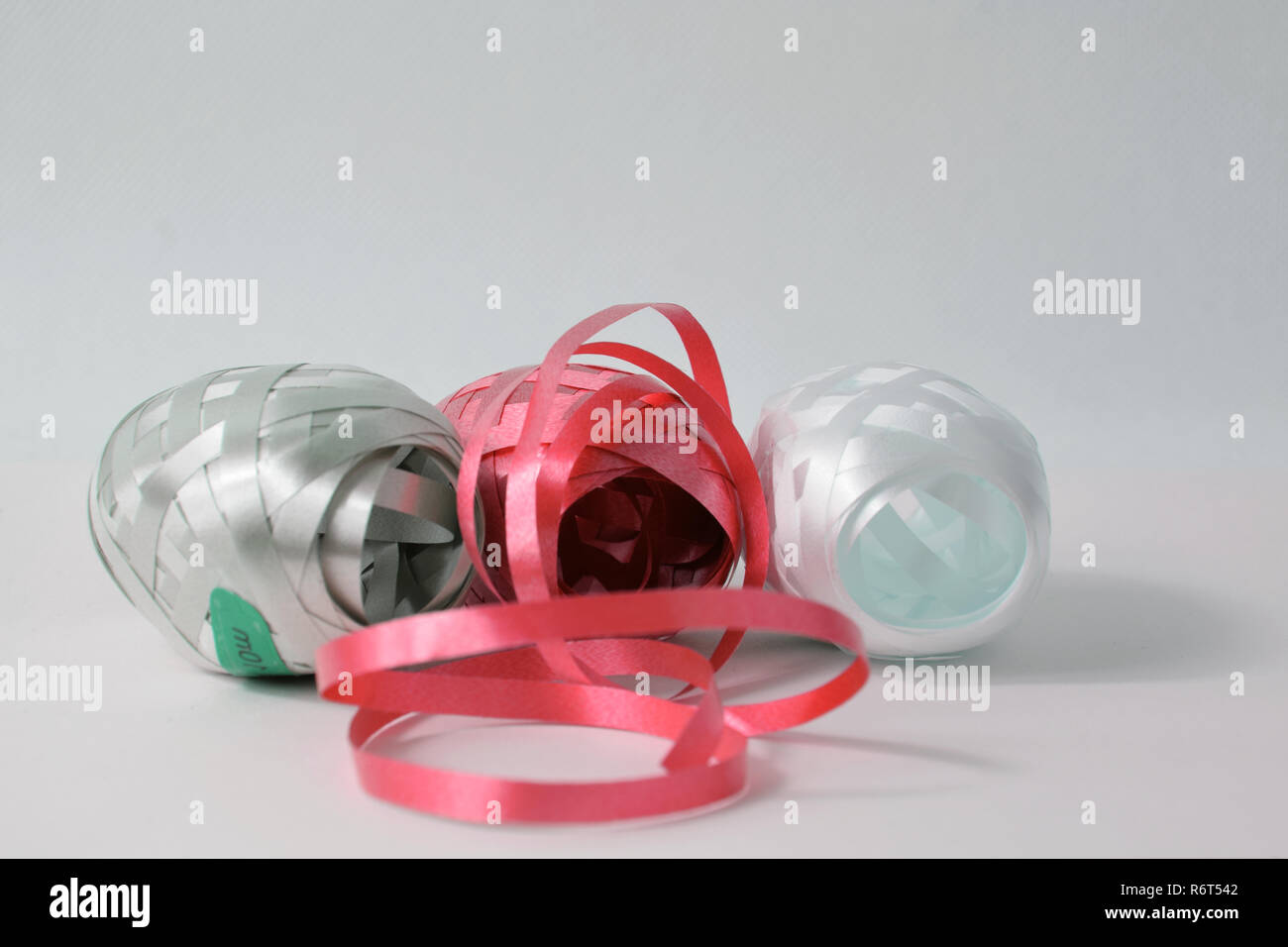 Curling Ribbon - Colorful gift wrapping band on white background Stock ...