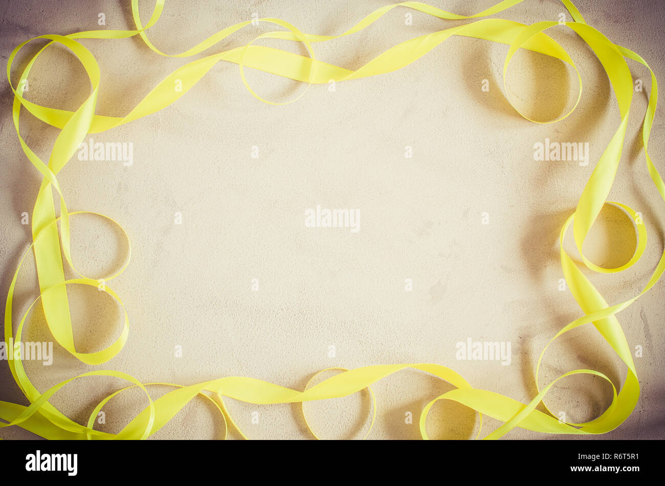 Decorative frame of satin yellow ribbon Stock Photo - Alamy