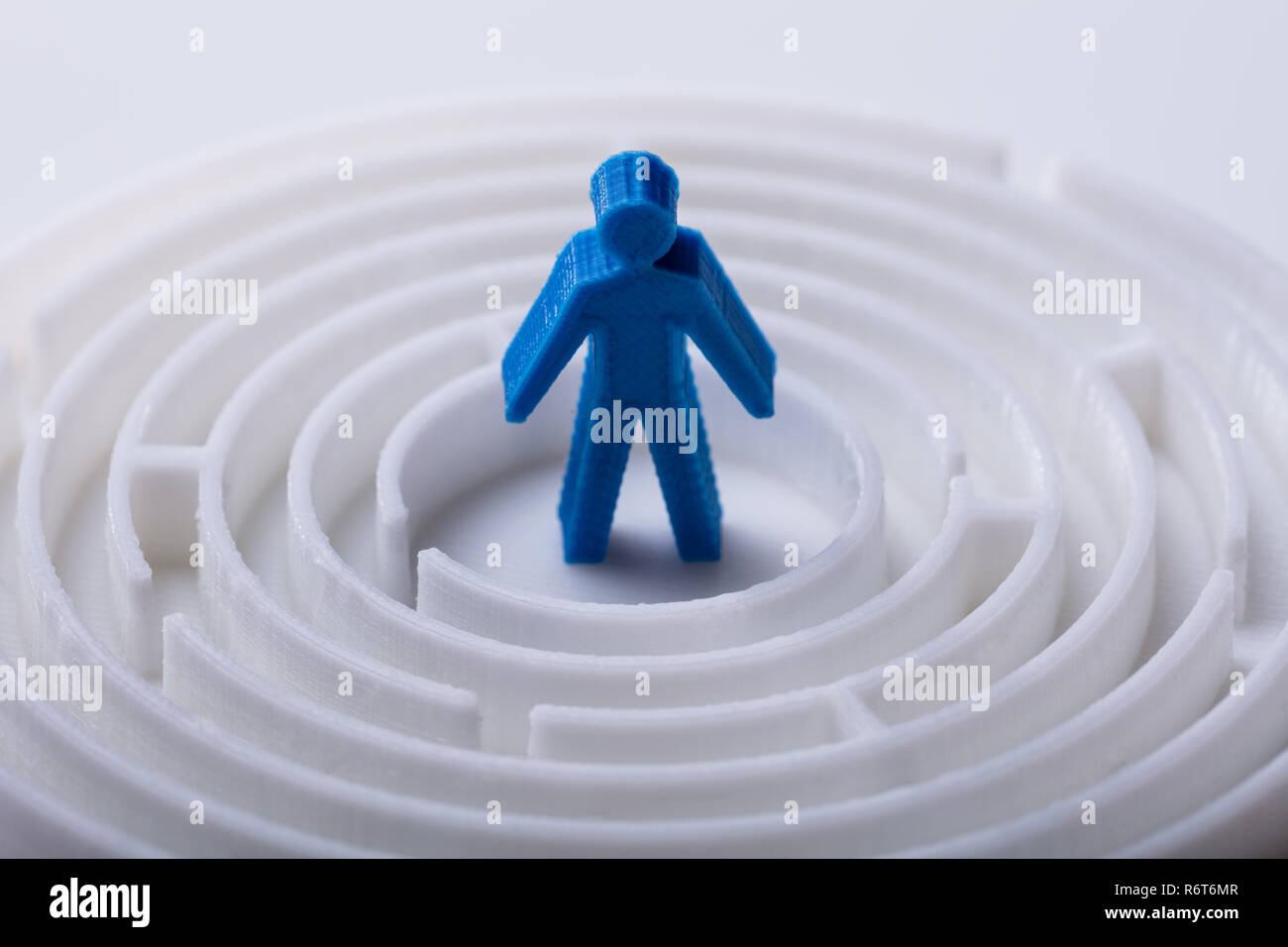 Human Figure Standing In Center Of Maze Stock Photo - Alamy