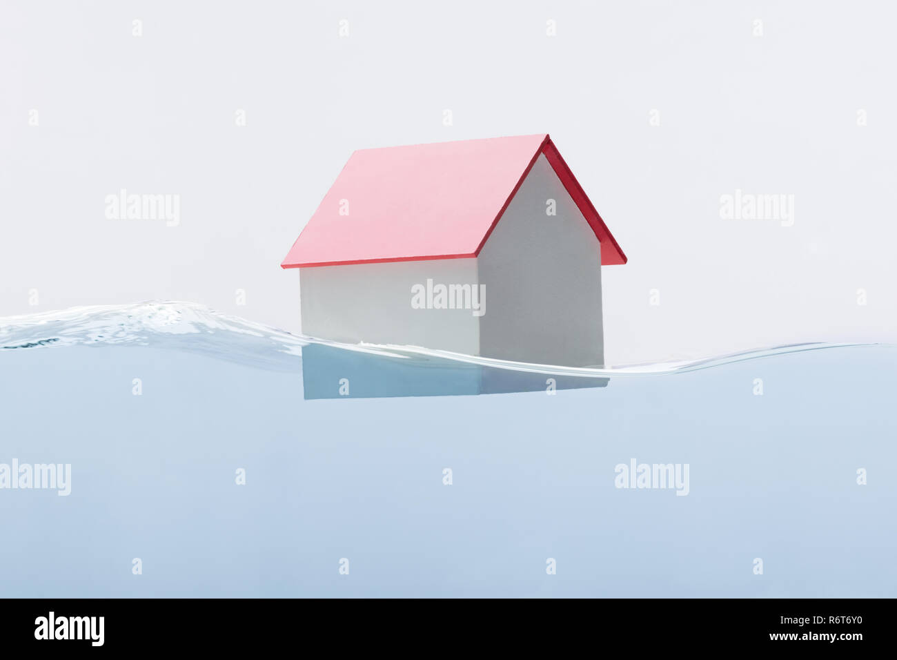 House Model Floating On Water Stock Photo - Alamy