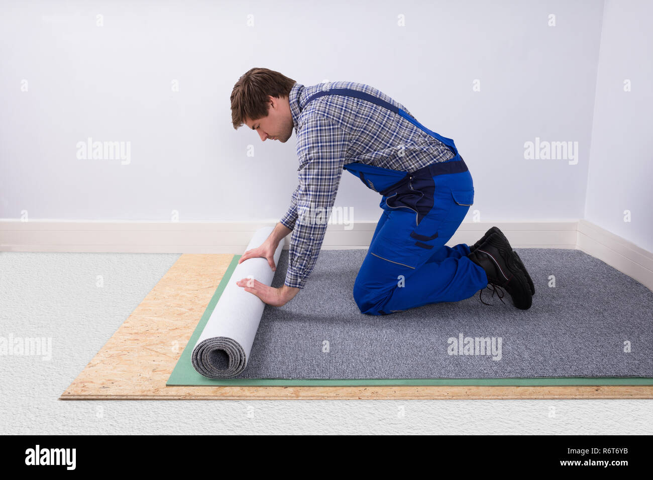 Worker Installing Carpet Stock Photo - Alamy